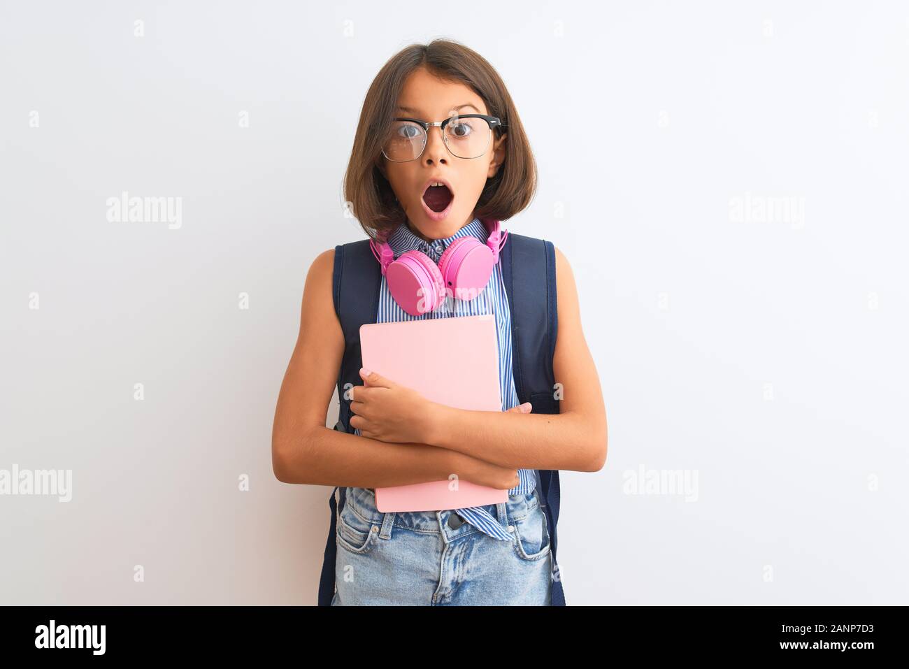 Student child girl wearing backpack glasses book headphones over ...