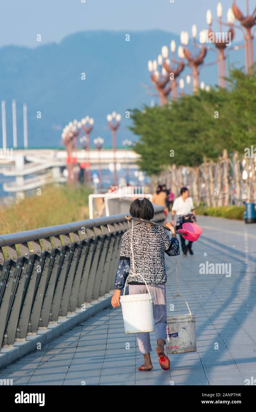 Carrying water with buckets hi-res stock photography and images - Alamy