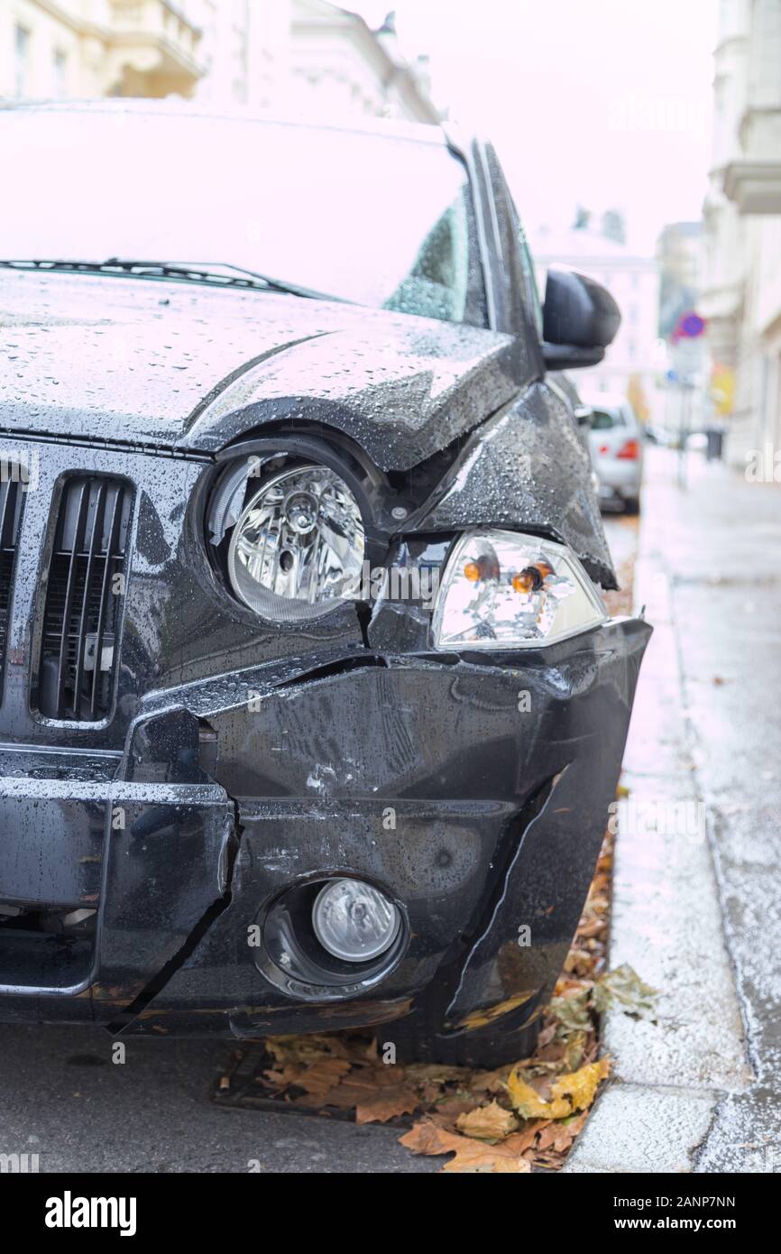 Close up of black damaged car, front view Stock Photo - Alamy