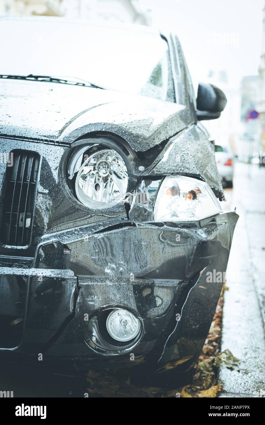 Close up of black damaged car, front view Stock Photo - Alamy
