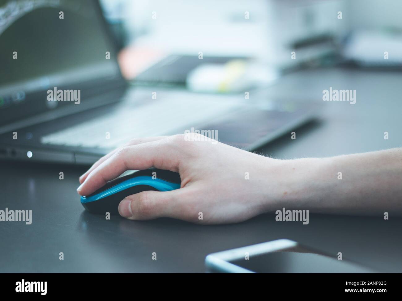 Close up of computer mouse used by a male hand Stock Photo - Alamy
