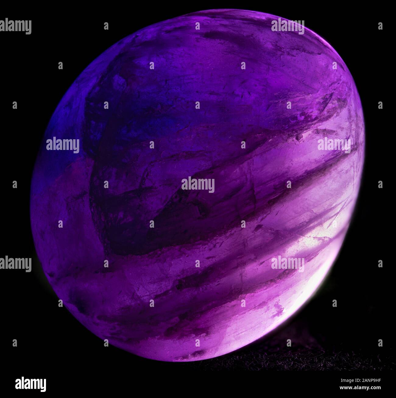 High resolution photograph of a glowing polished amethyst mineral Stock ...