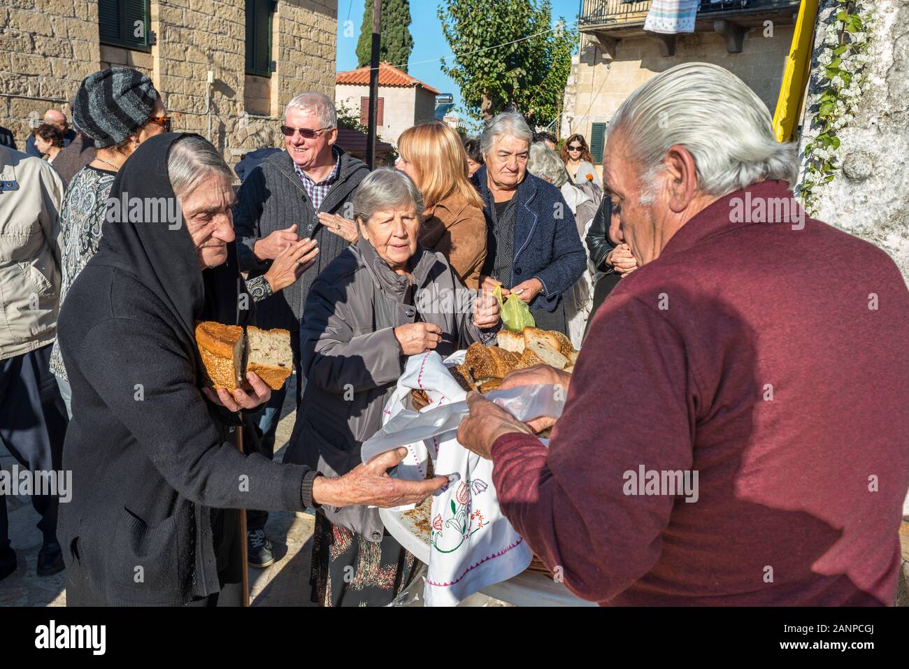 Distributing the traditional 'Artos bread', cinnamon flavoured ...