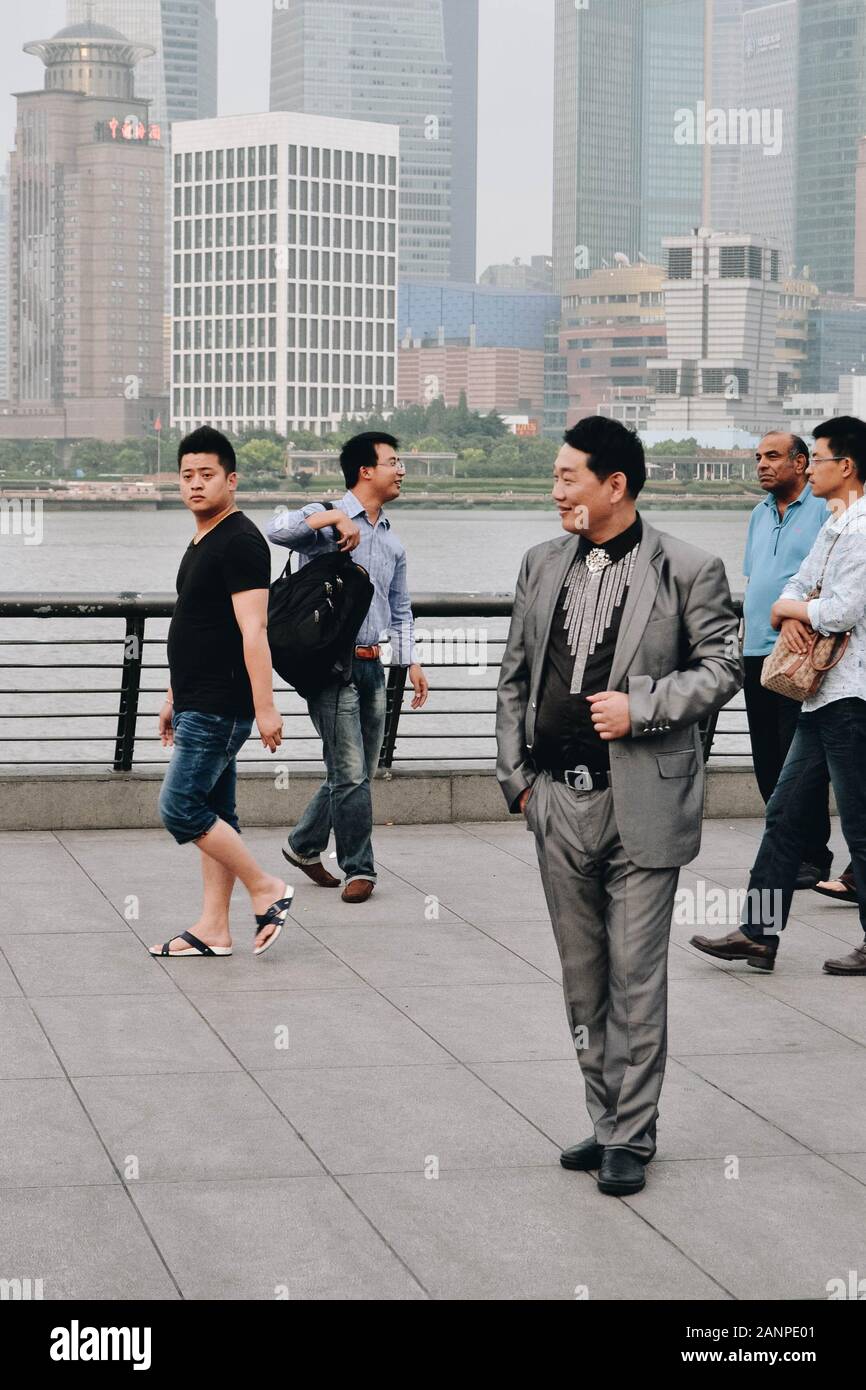 Chinese man posing for a picture Stock Photo - Alamy