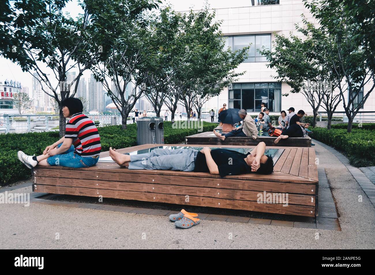 People resting in a park Stock Photo - Alamy