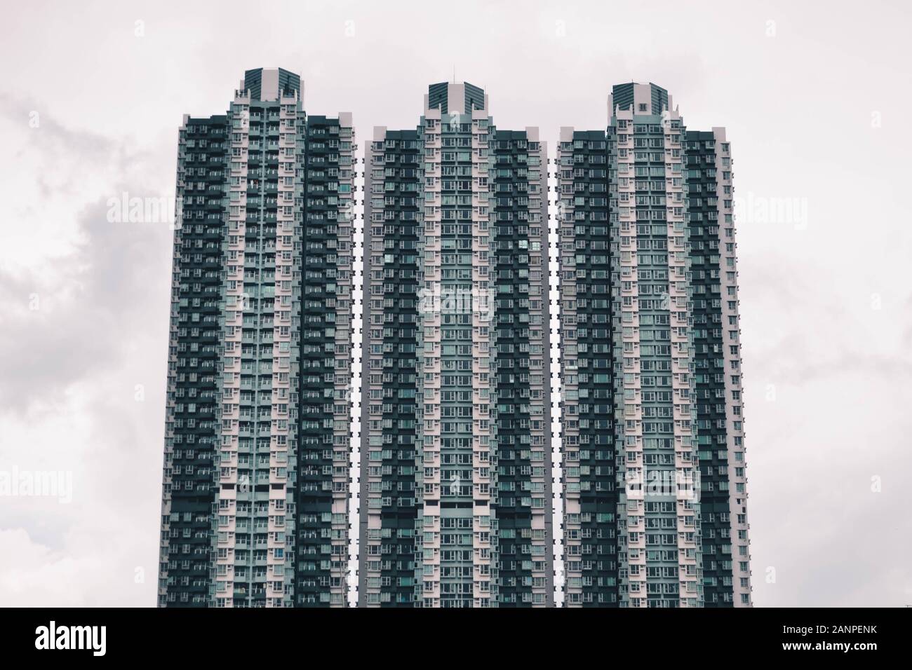 Three identical towers in the harbour of Hong Kong Stock Photo - Alamy