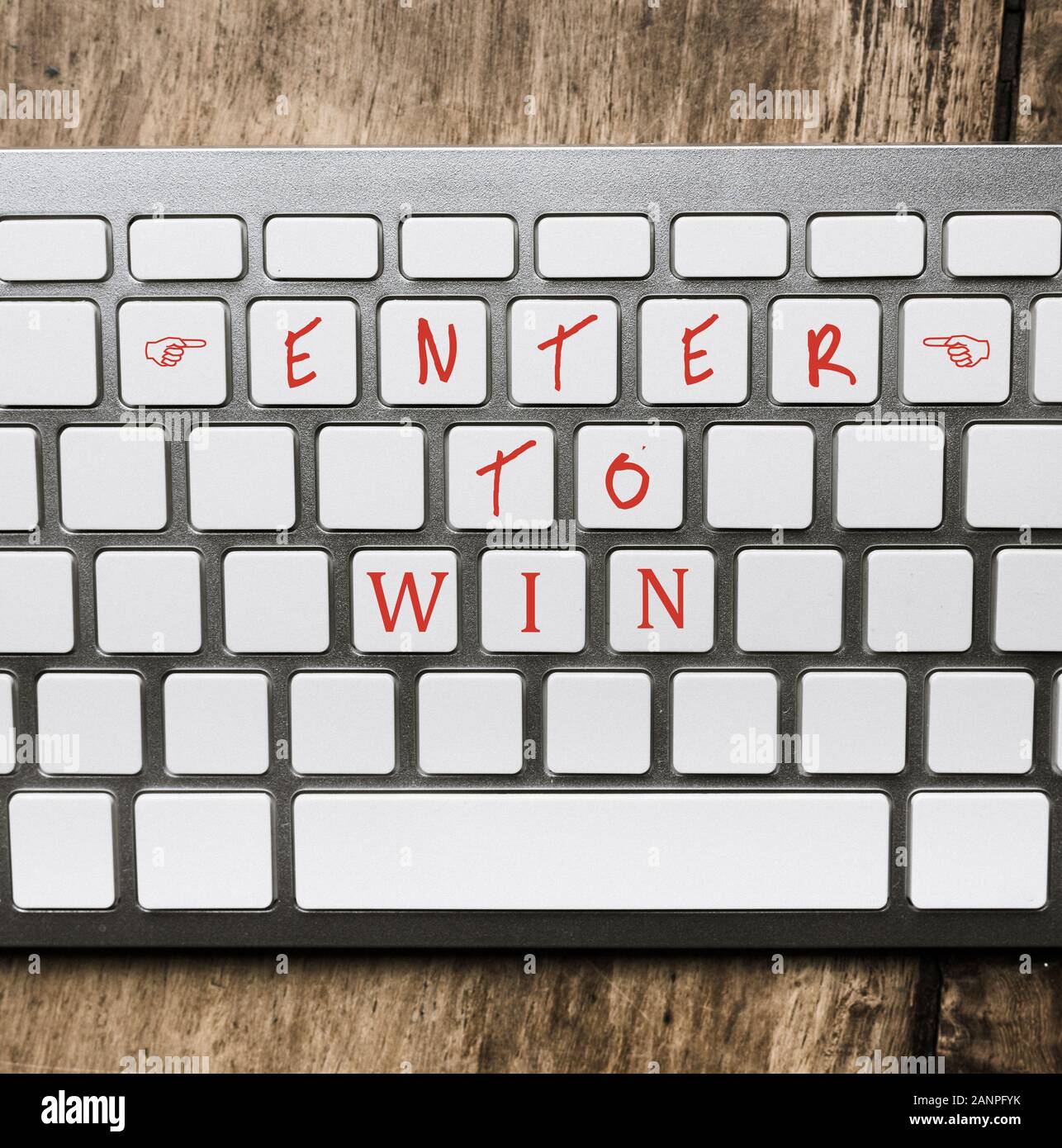 Silver keyboard with words Enter to win Stock Photo - Alamy