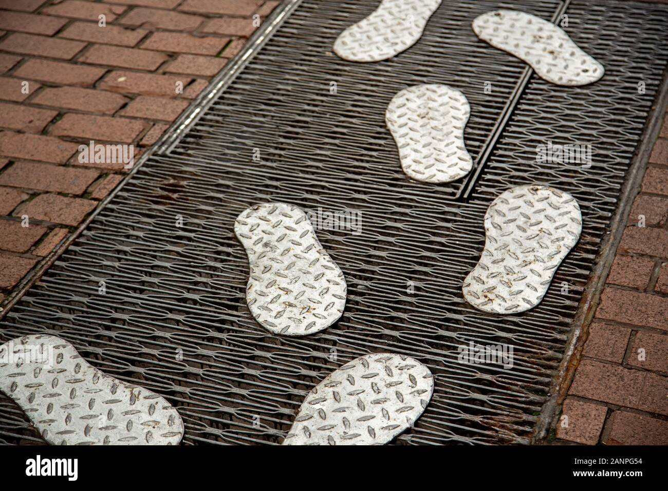 Metal walkway grille art Stock Photo - Alamy