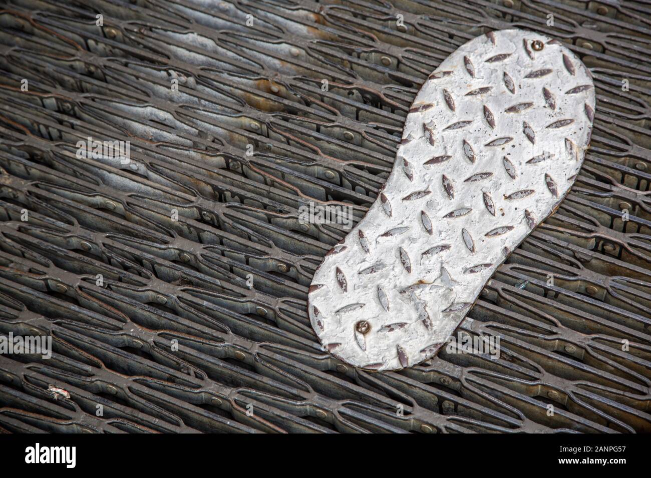 Metal walkway grille art Stock Photo - Alamy