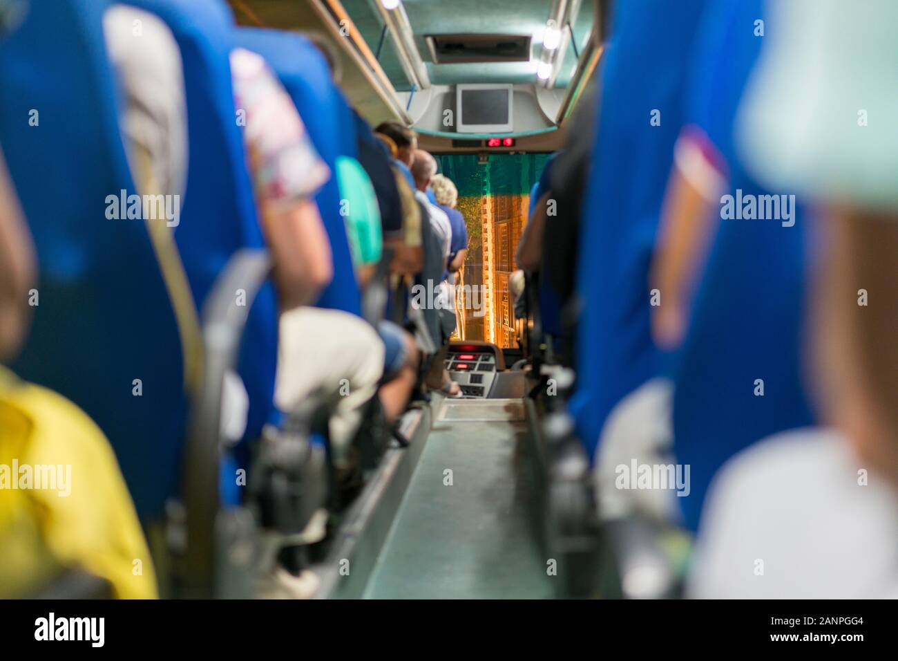Passengers on a tourist bus. selected focus Stock Photo - Alamy