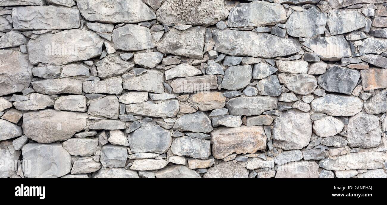 Background of stone wall texture photo Stock Photo - Alamy
