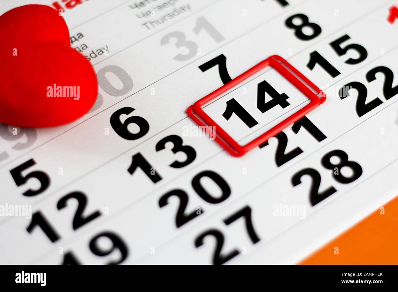 Calendar with red mark on 14 February. Red hearts decoration ...