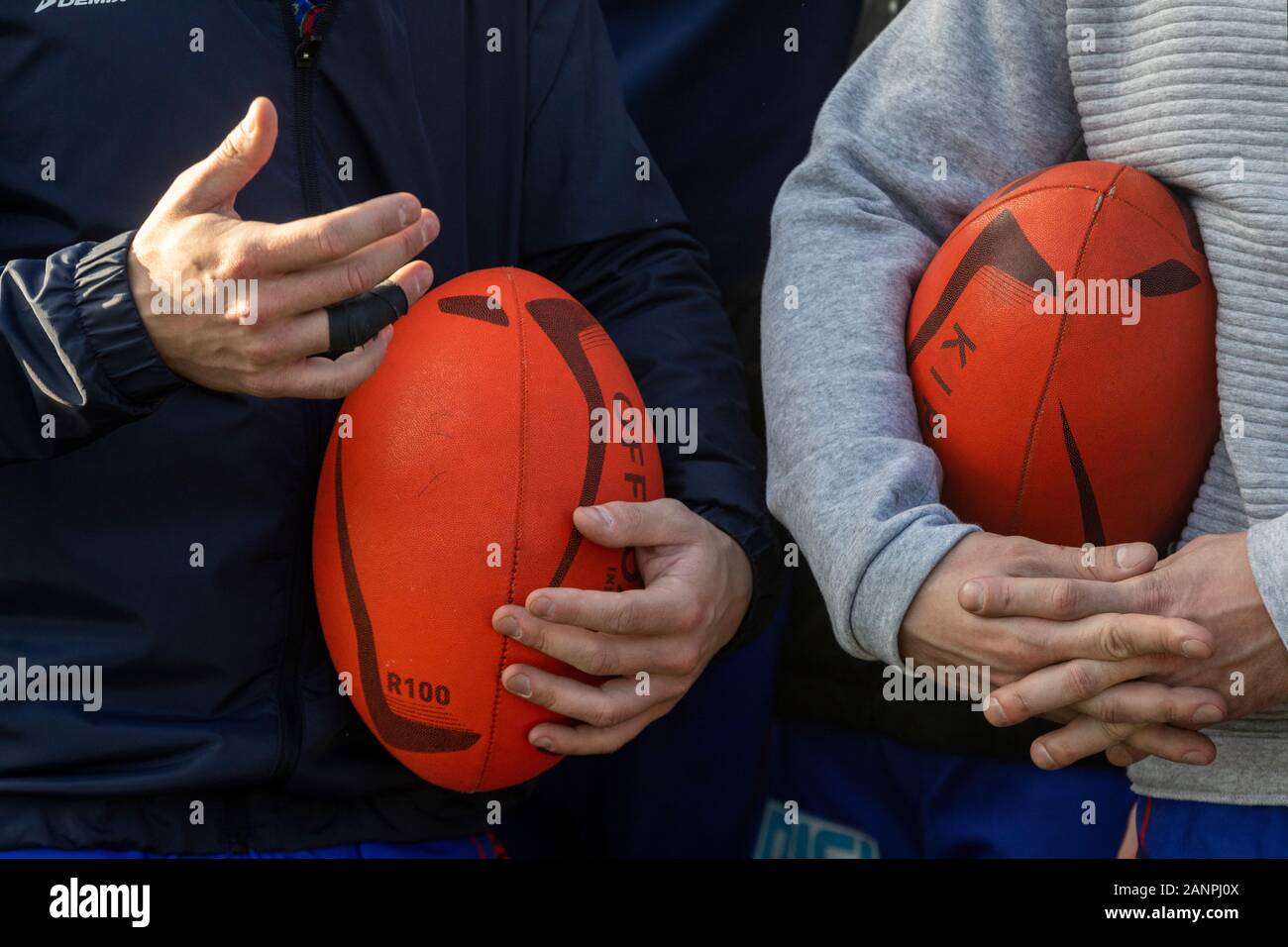 a coach holds the Rugby balls on a stadium during a team training Stock ...