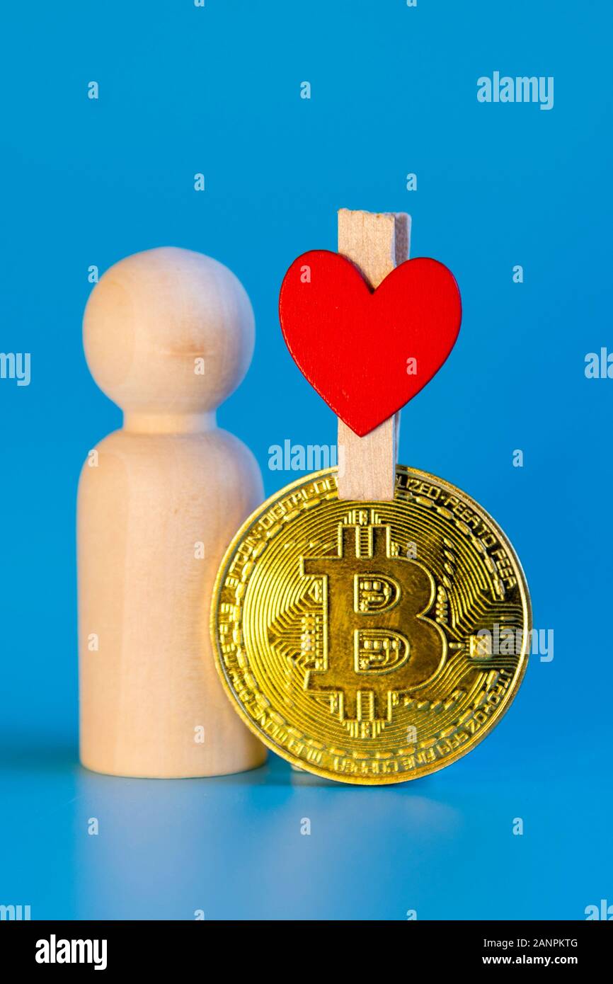 Human figurine, bitcoin coin and heart on a blue background. love for ...