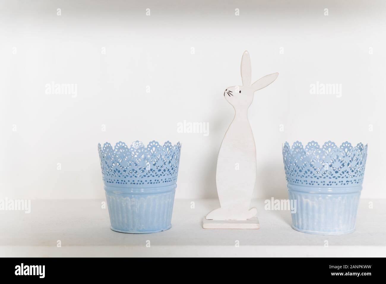 Mock up white frame with modern white Easter bunny decor on a shelf or ...