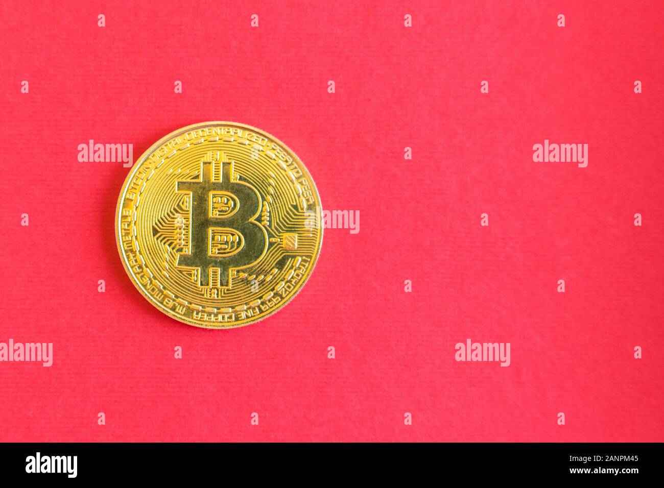 Golden Bitcoins digital virtual money on red background. copy space ...