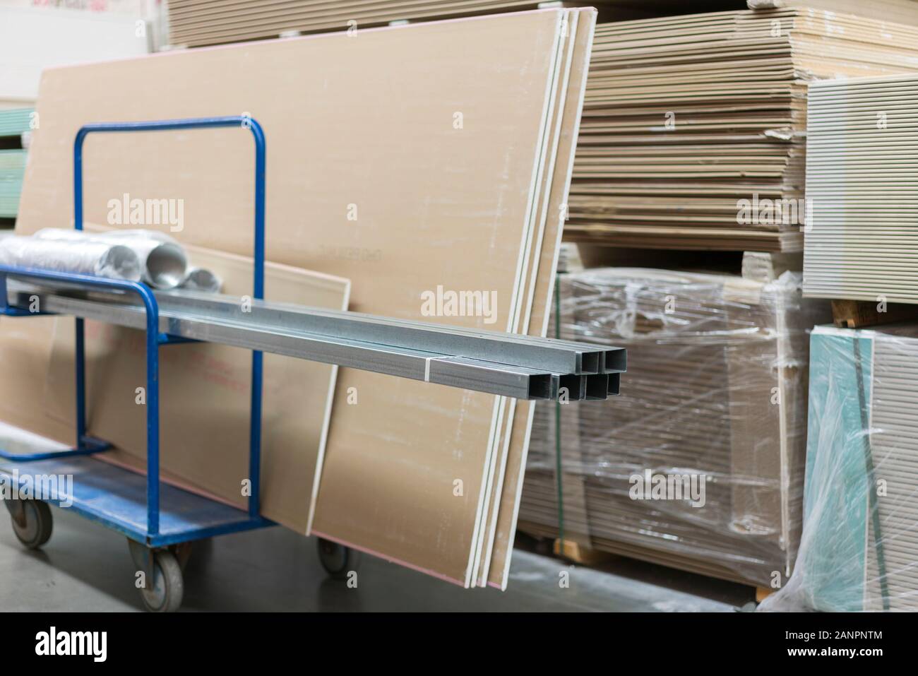 Trolley in a hardware store loaded with construction materials. Repair ...