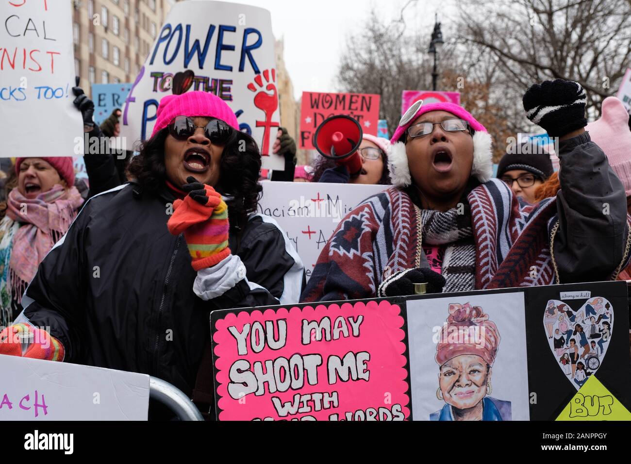 New York, New York, USA. 18th Jan, 2020. People hold signs and ...