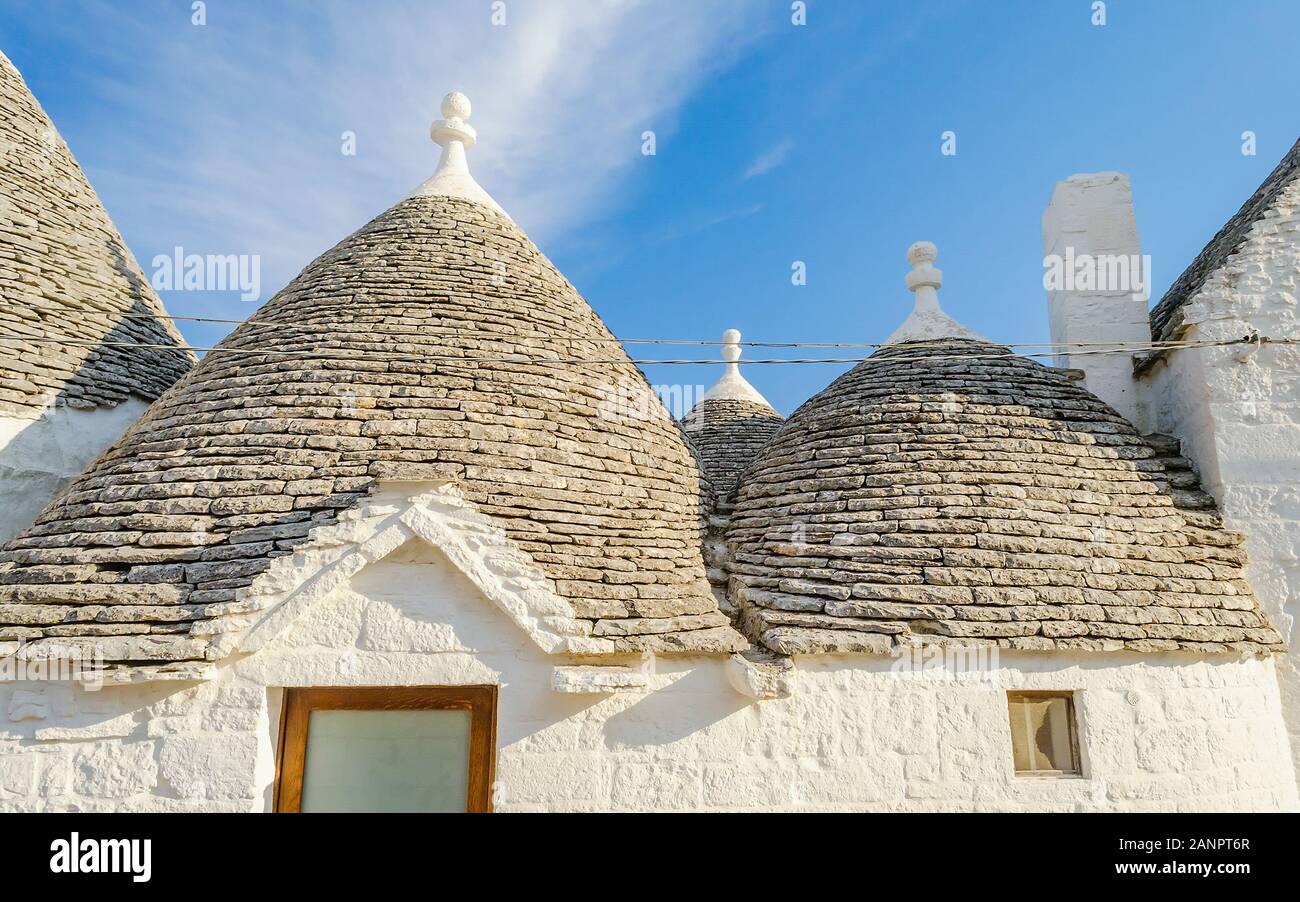 Typical trulli buildings with conical roofs in Alberobello, Apulia ...