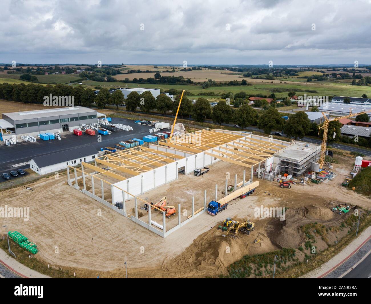 on a building site wooden trusses are built on the concrete columns of ...