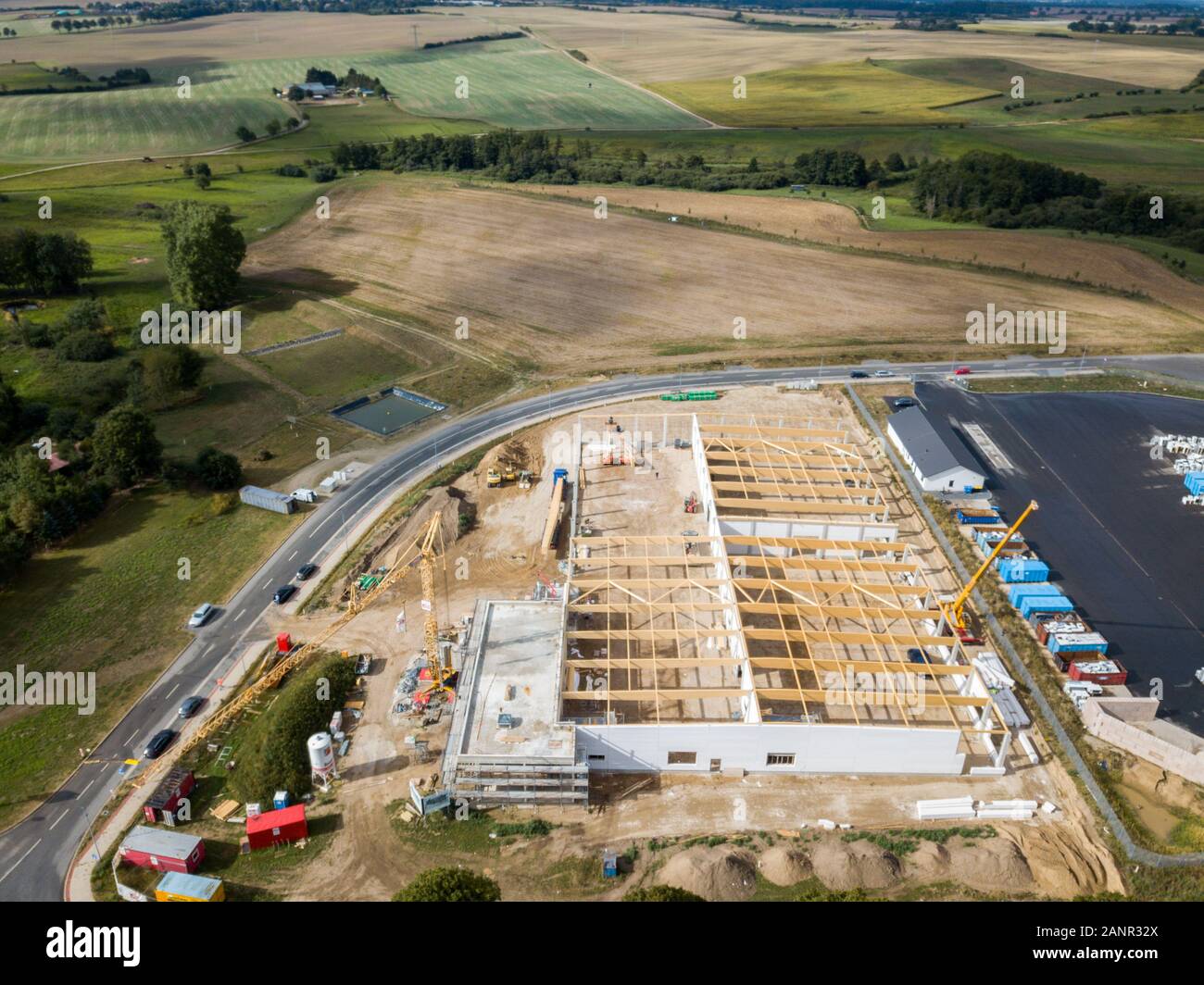 on a building site wooden trusses are built on the concrete columns of ...