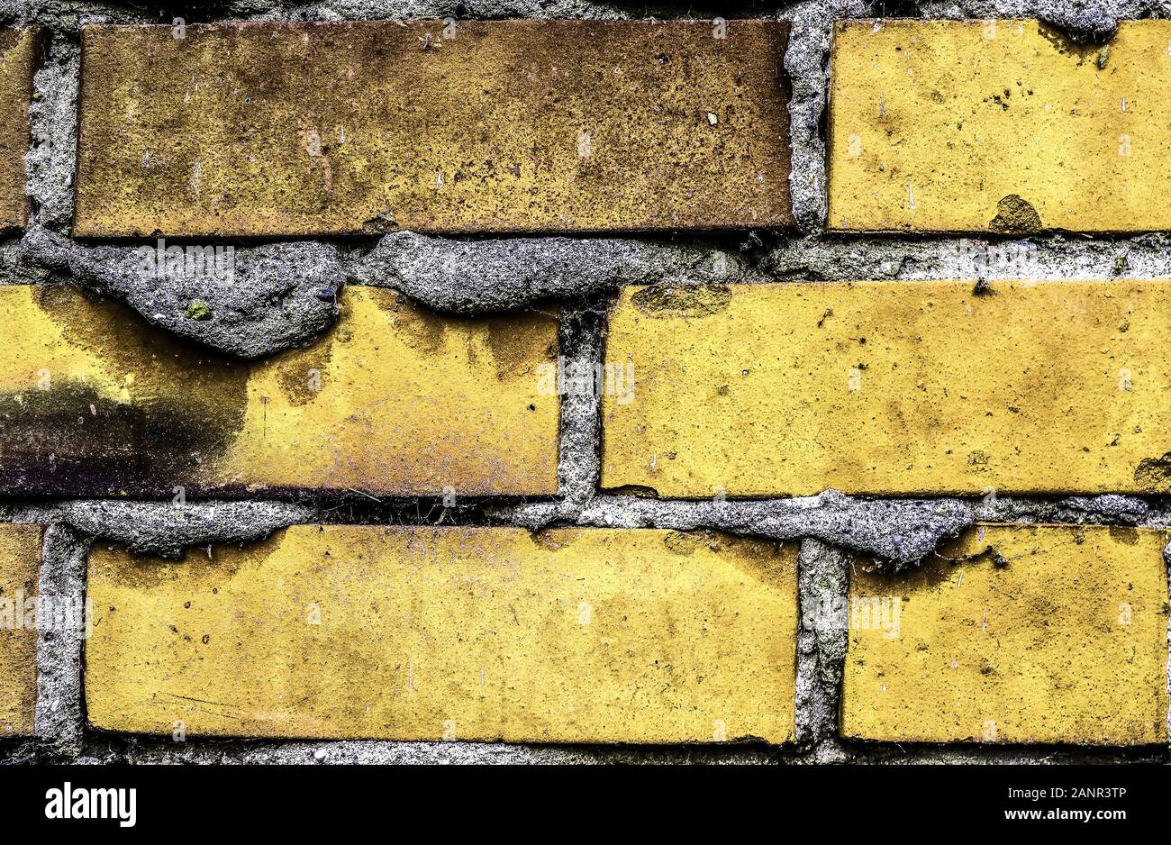 Detailed view on aged and weathered yellow brick wall textures Stock ...