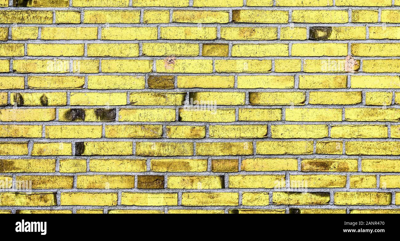 Detailed view on aged and weathered yellow brick wall textures Stock ...