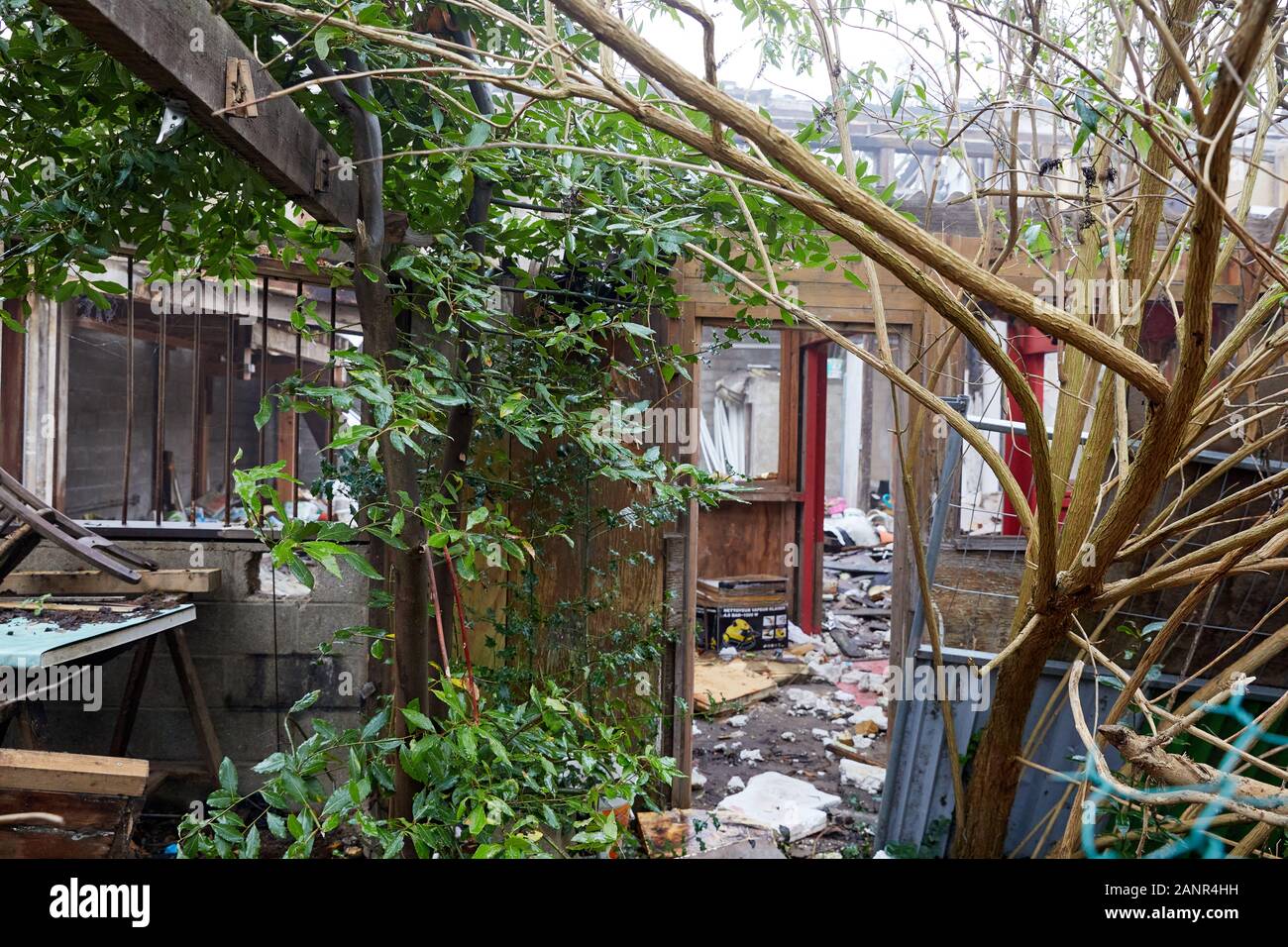 Abandoned, partly collapsed house full of waste Stock Photo - Alamy