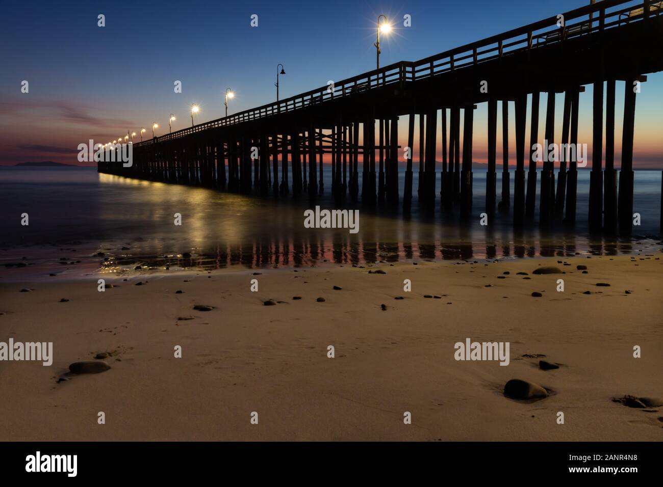 Wooden posts shore sky sunset beach hi-res stock photography and images ...