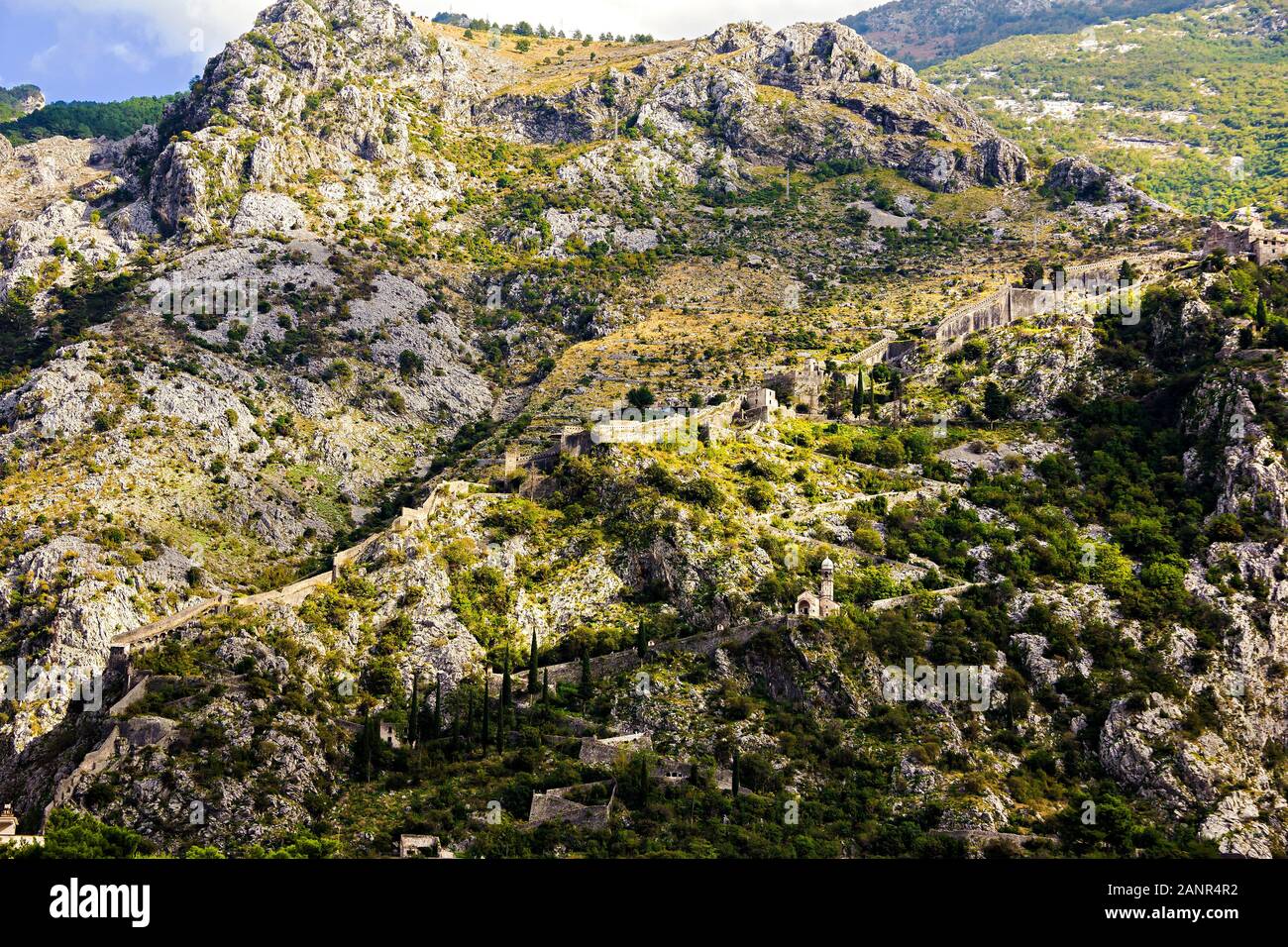 Ancient walls of Kotor Fort (St John Fortress) in the mountains slope ...