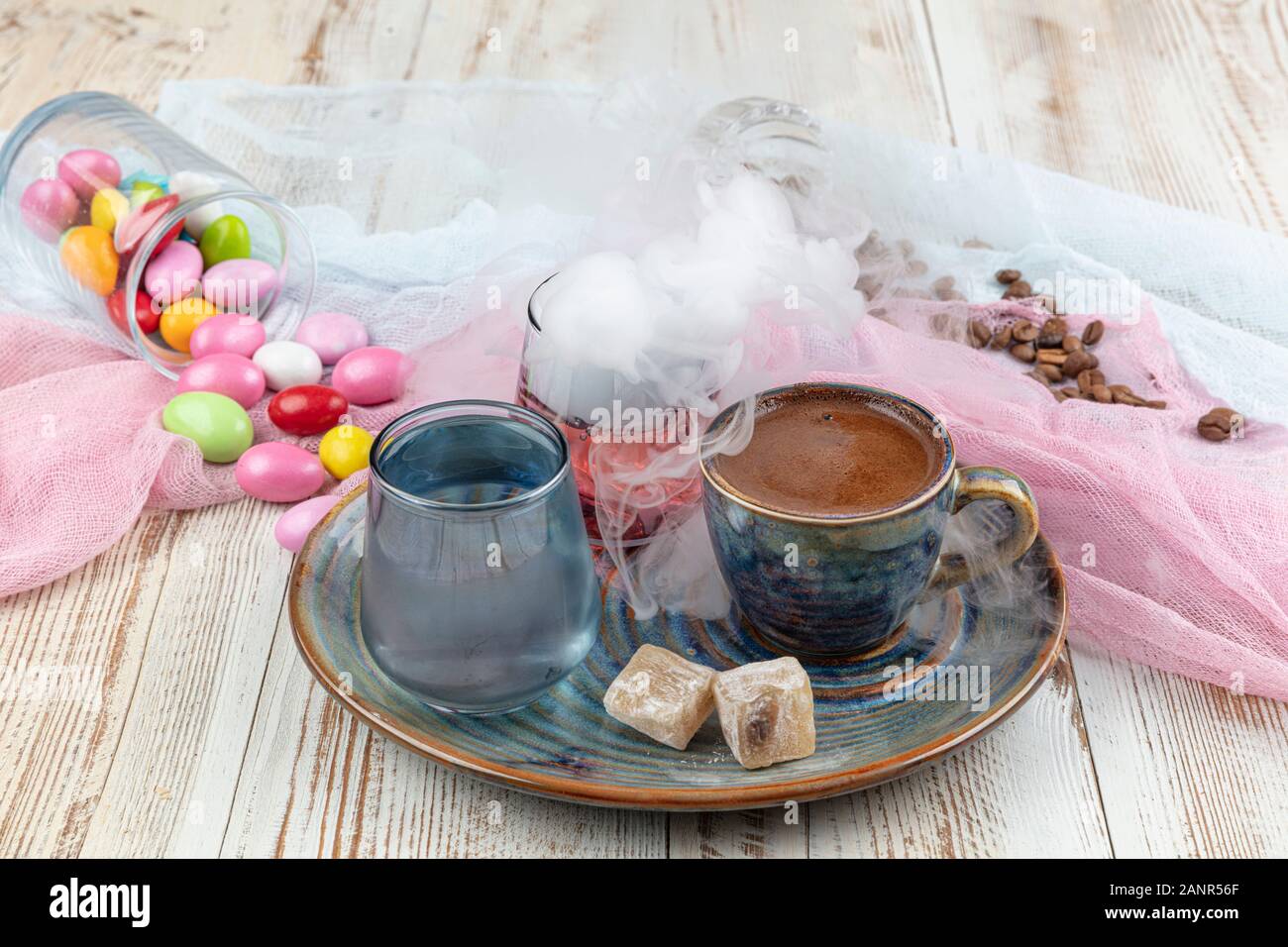 Traditional turkish coffee in porcelain cup set,a glass of water and ...