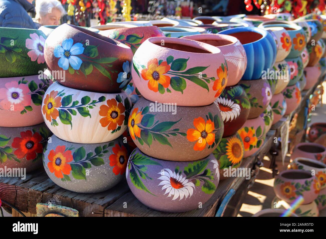 Bright colorful Mexican pottery stacked on display for sale Stock Photo ...