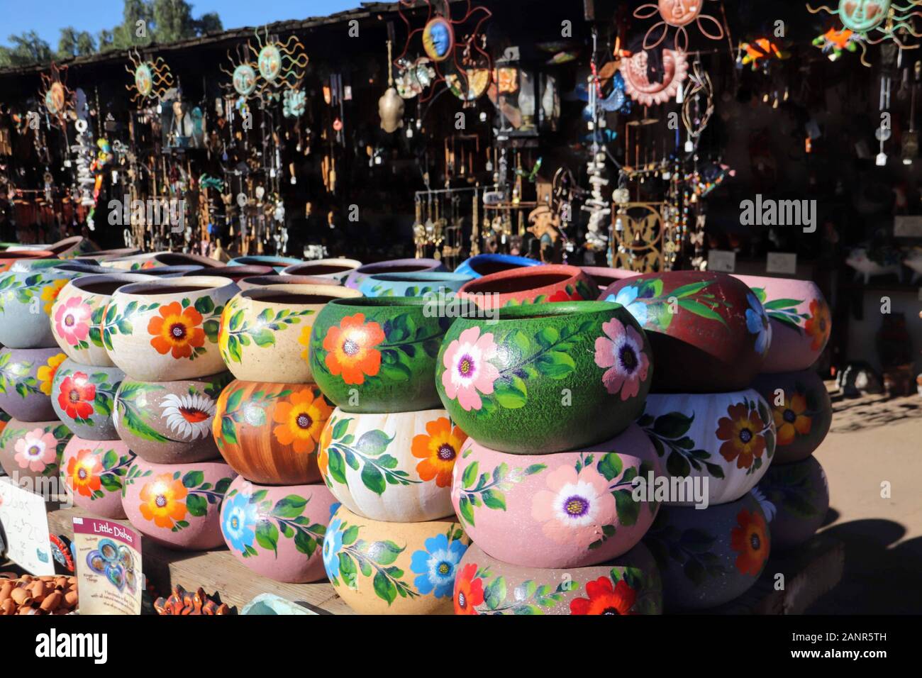 Bright colorful Mexican pottery stacked on display for sale Stock Photo ...