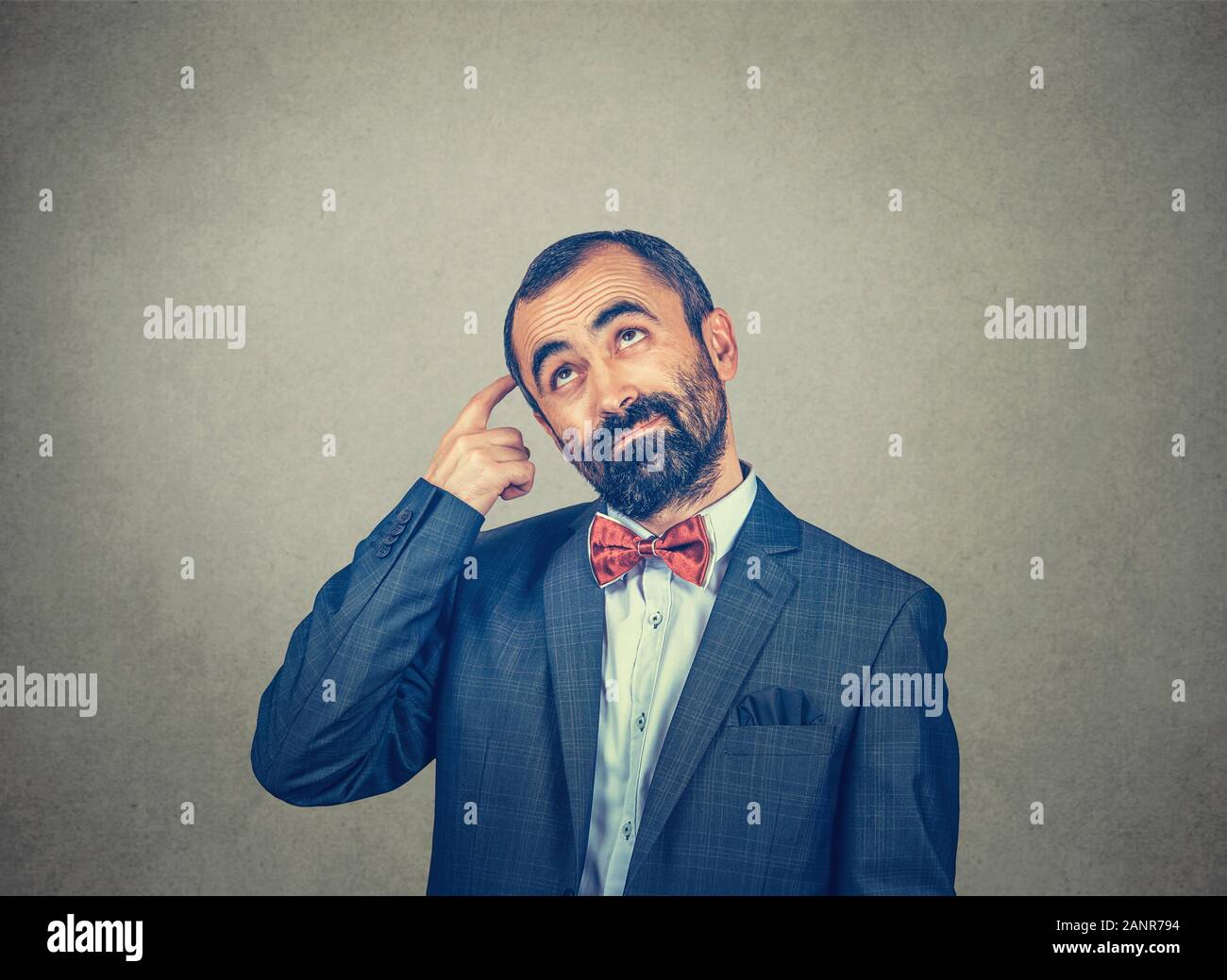 Closeup portrait man scratching head, thinking deeply about something ...