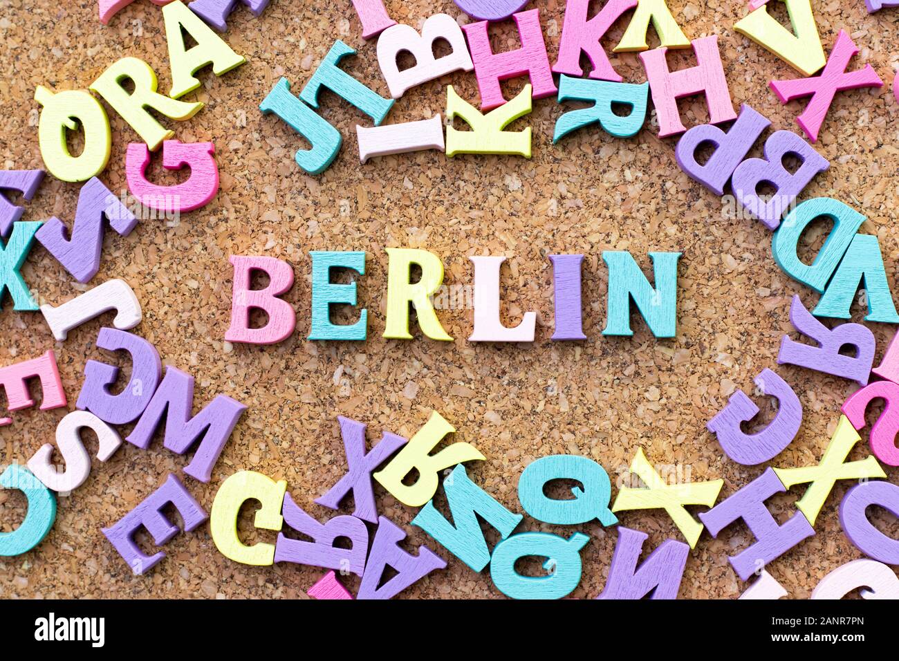 Color alphabet in word Berlin with another letter as frame on cork ...