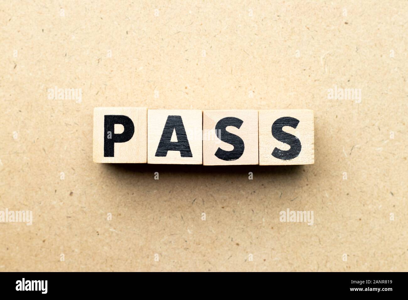 Letter block in word pass on wood background Stock Photo - Alamy