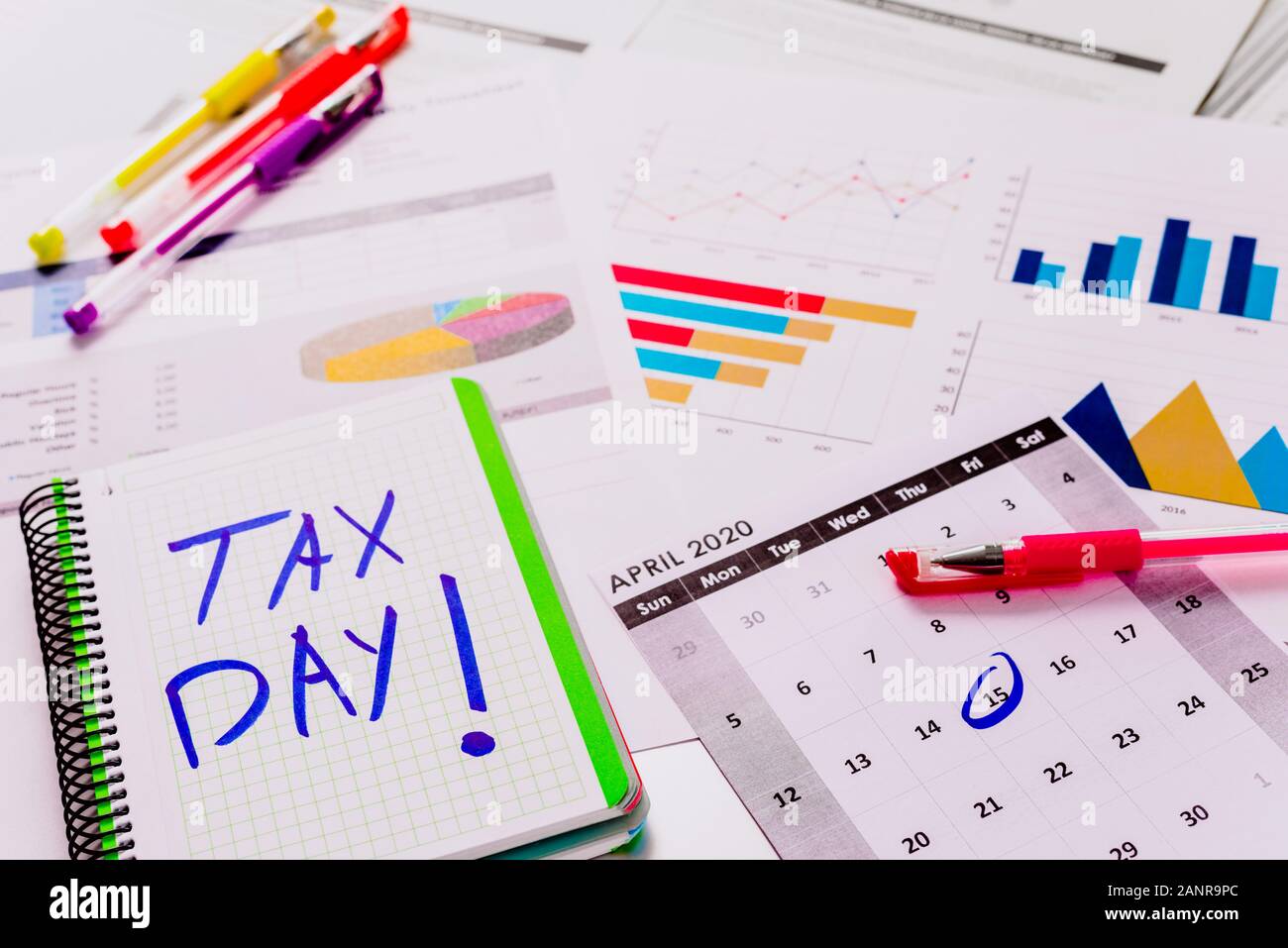 Calendar with April 15, 2020 marked as tax payment day and charts ...