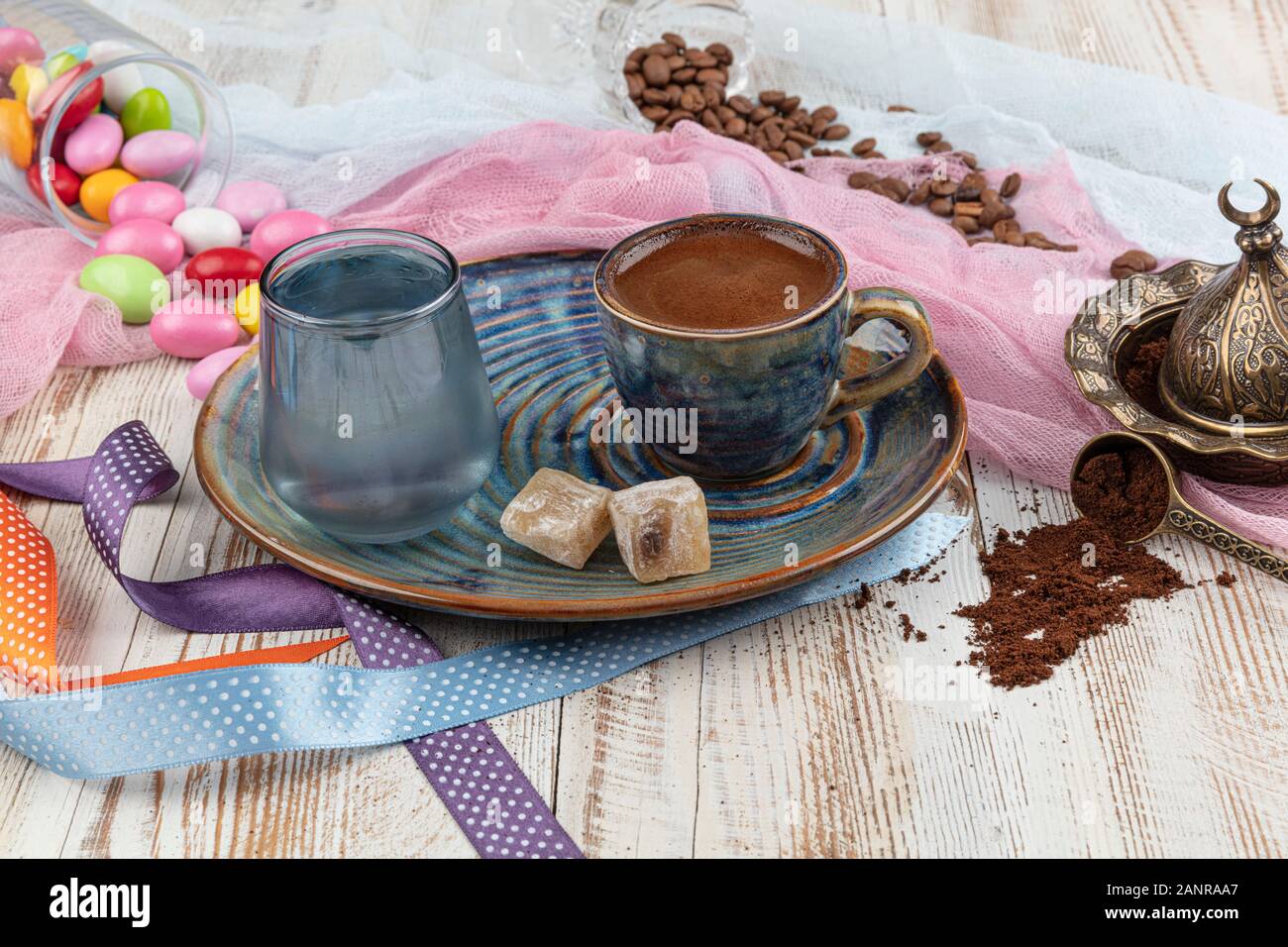 Traditional turkish coffee in porcelain cup set,a glass of water and ...