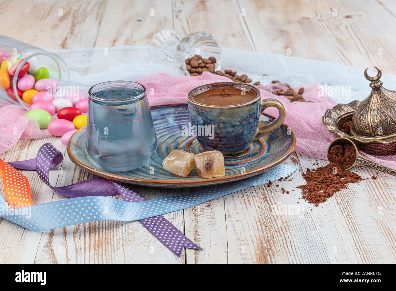 Traditional turkish coffee in porcelain cup set,a glass of water and ...