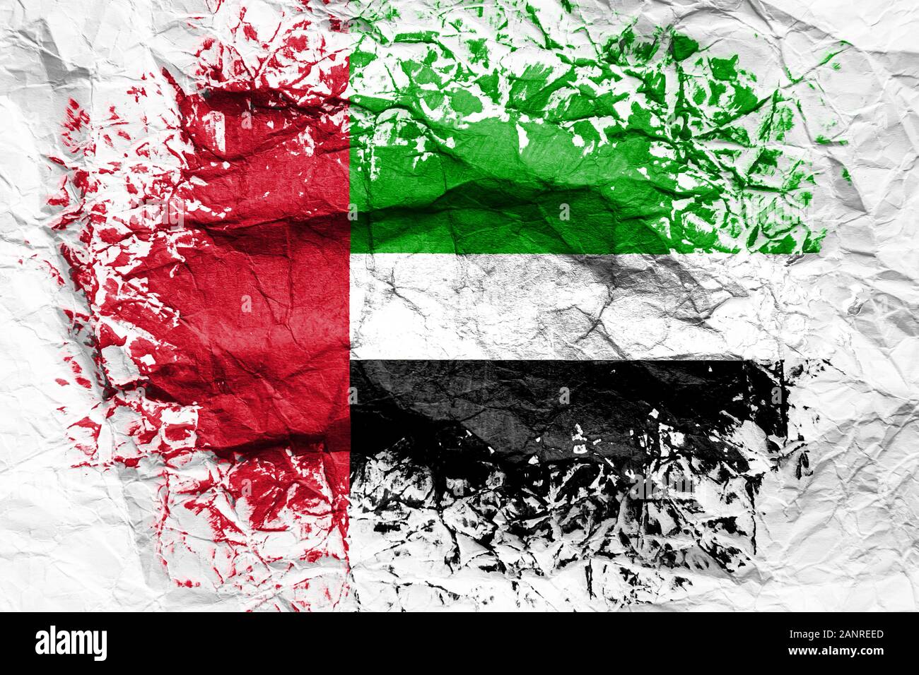 The national flag of the United Arab Emirates is painted on crumpled ...