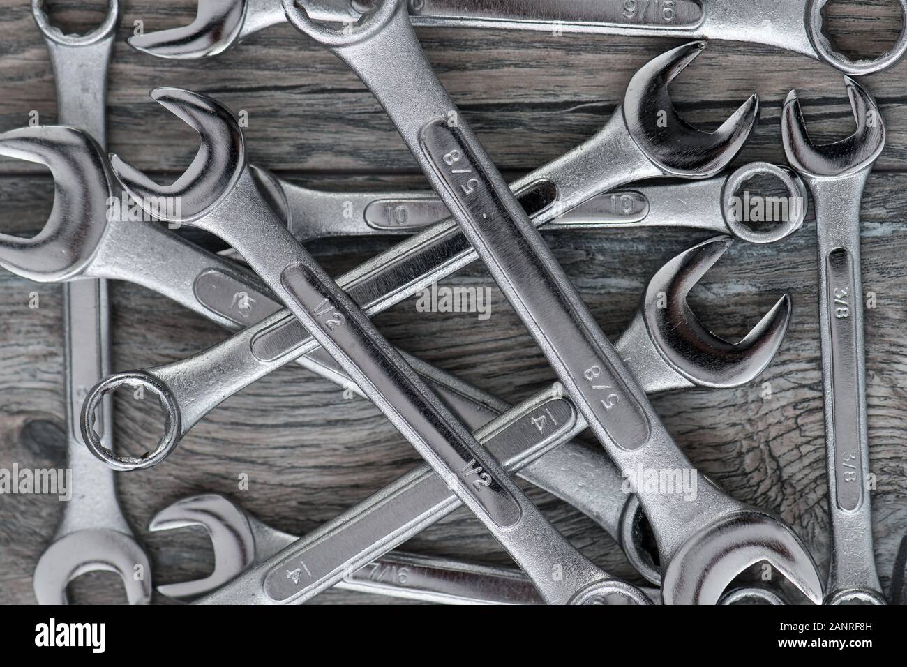 Pile Of Wrenches on Wood Floor. Silver and Chrome tools. Top View Stock ...