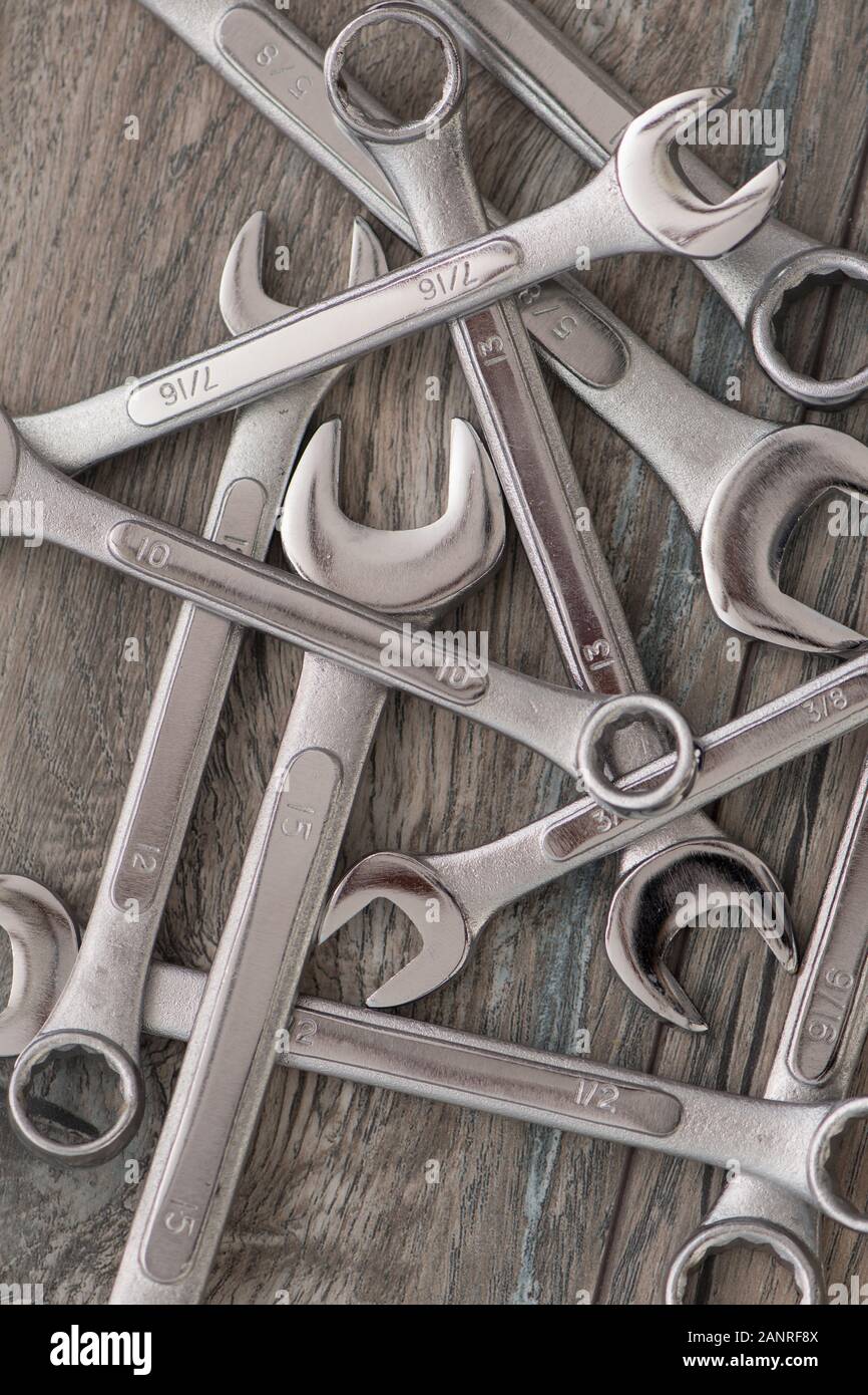 Pile Of Wrenches on Wood Floor. Silver and Chrome tools. Top View Stock ...