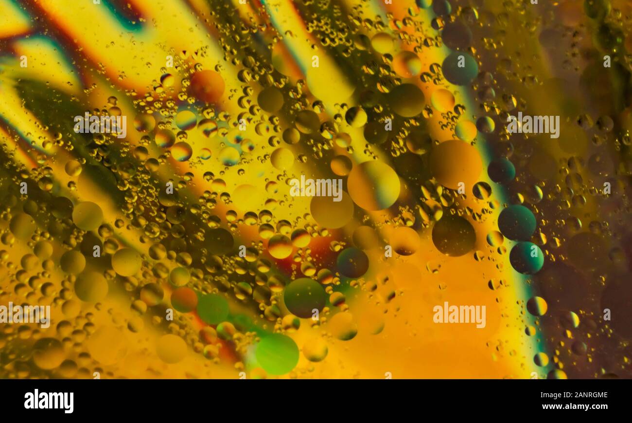 colorful cooking oil bubbles in water.abstract mosaic tiles textured ...