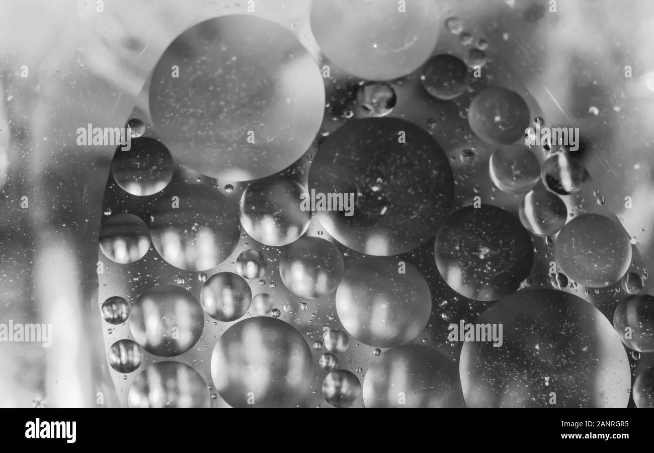 Close up image of water droplets in cooking oil with blurred background ...