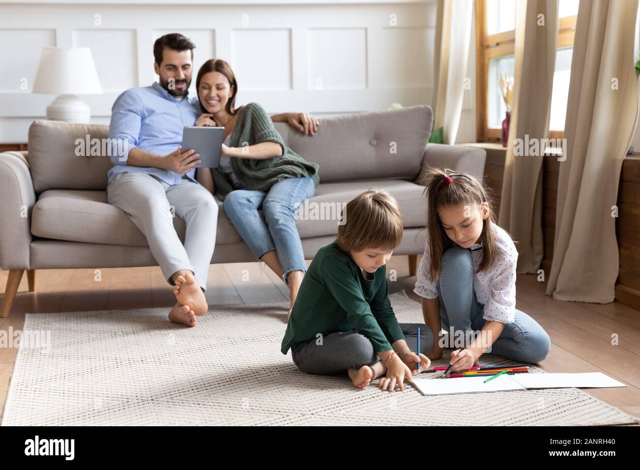 Happy family with kids enjoy weekend at home Stock Photo - Alamy
