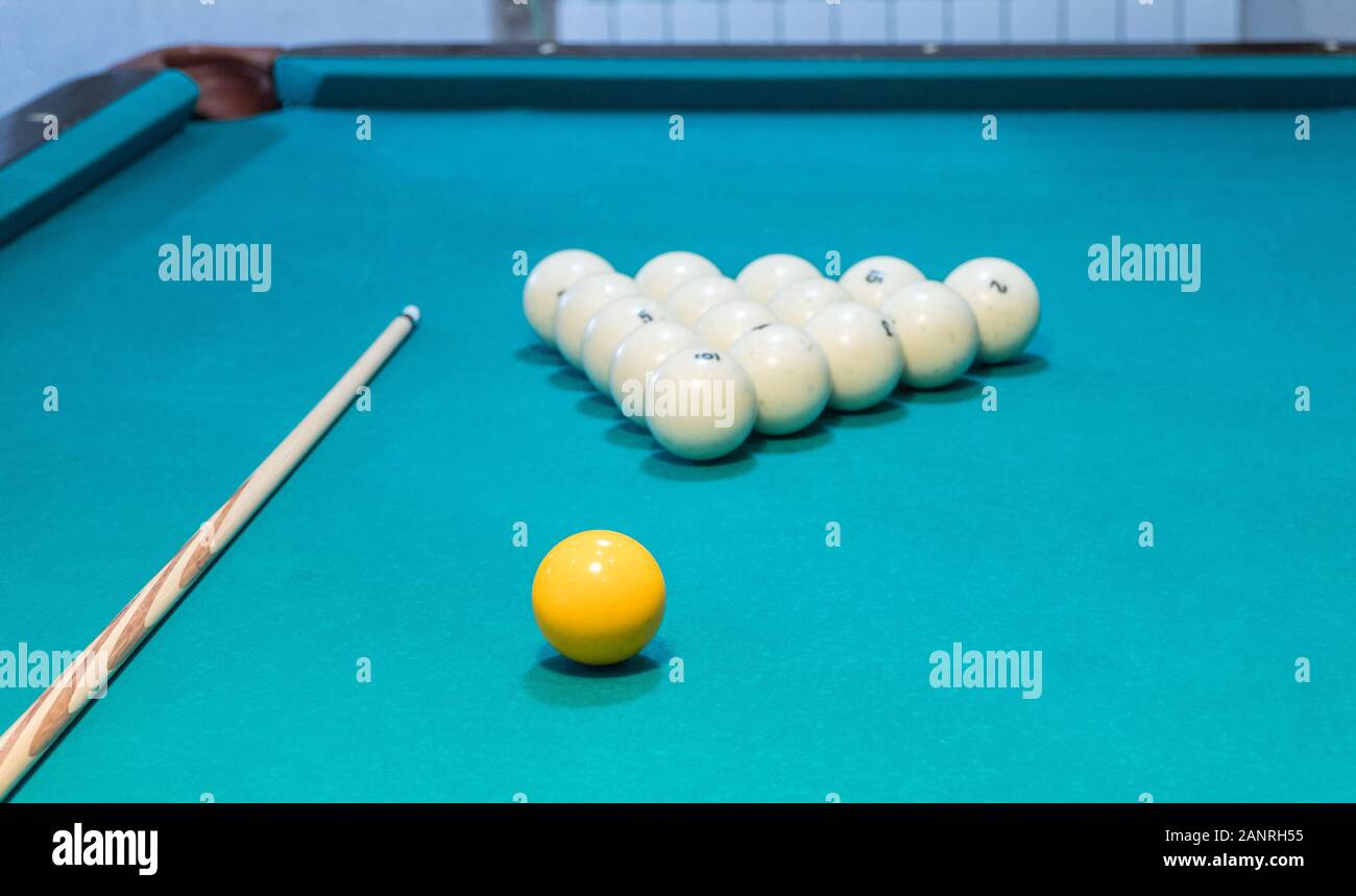 Green billiard table with white balls and cue Stock Photo - Alamy