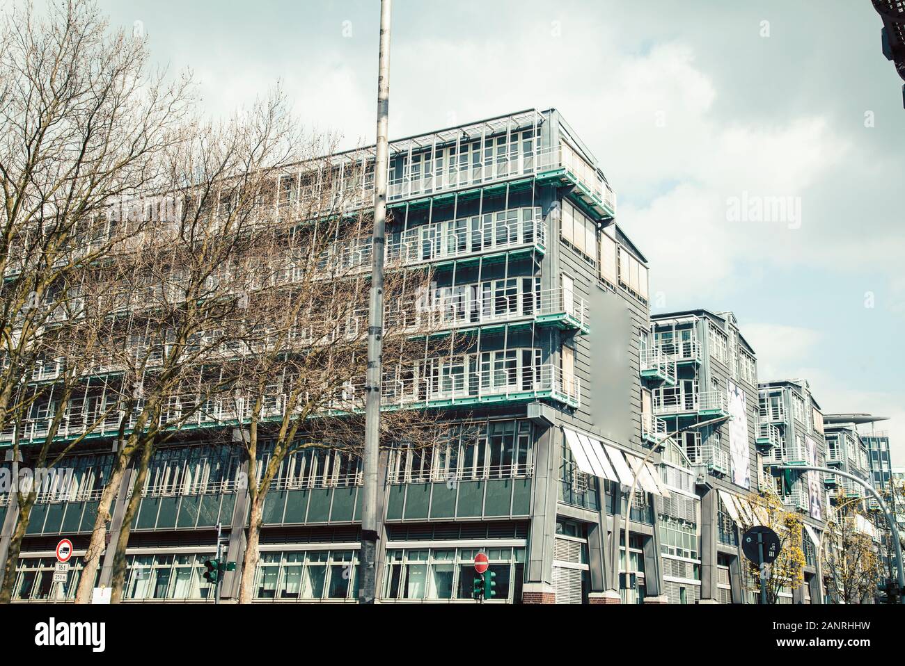 post card view: european city street with spring tree on building ...