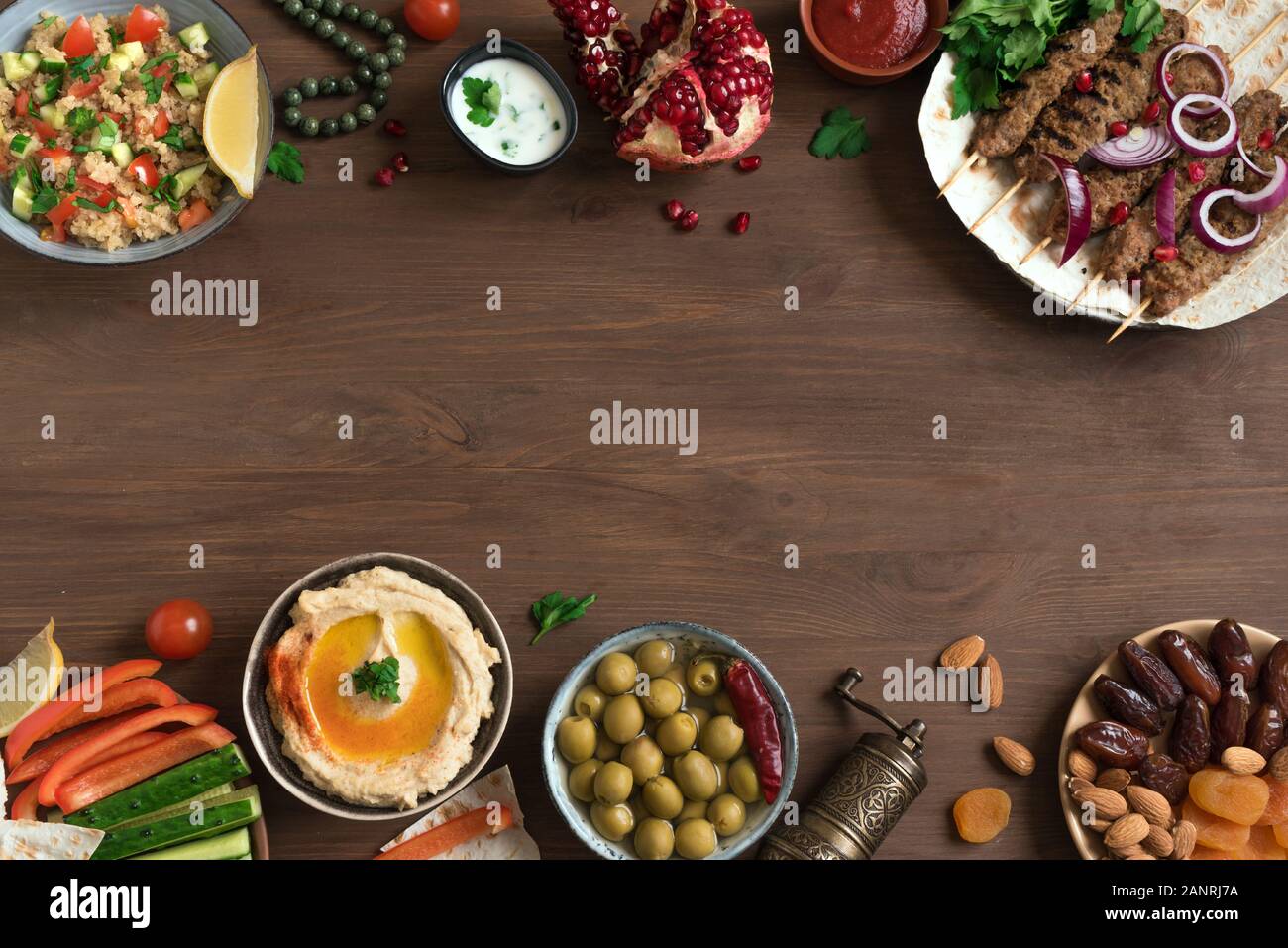 Middle Eastern Arabic food, dinner table. Meat kebab, hummus, tabbouleh ...