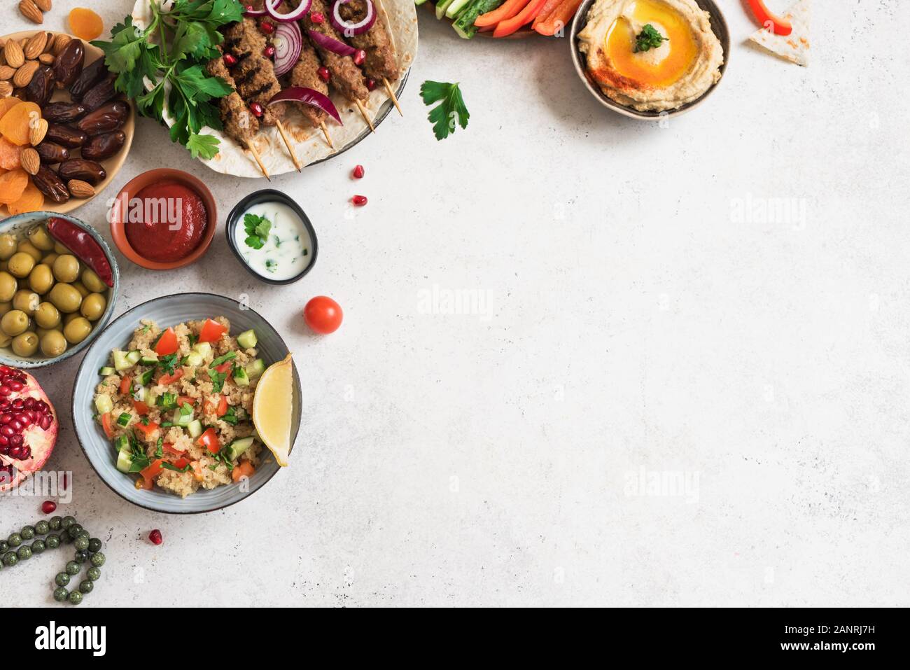 Arabic and Middle Eastern food, dinner table. Meat kebab, hummus ...