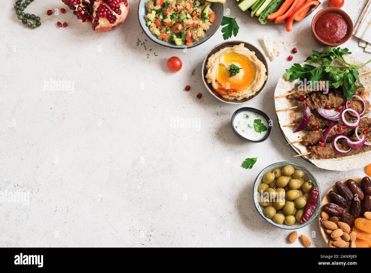 Arabic and Middle Eastern food, dinner table. Meat kebab, hummus ...